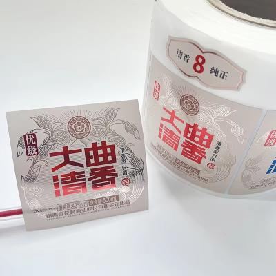 China China Direct Factory Self-adhesive Red Wine Packaging Sticker Label Liquor Glass Bottle Silver Foil Embossed Logo Label Roll for sale