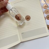 China Hot Sale Custom Round Adhesive Label Vinyl Embossed Rose Gold Foil Texture Paper Perfume Bottle  Circle Label Sticker Sheet for sale