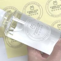 China Custom Printed Clear Black Transparent  Waterproof Label Seal Round Clear Cosmetic Box Packaging Label Sticker for sale