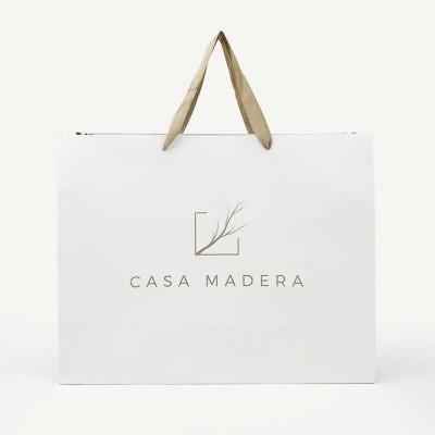 China Mini Washable Paper Tote Gift Bags Portable With Your Own Logo for sale