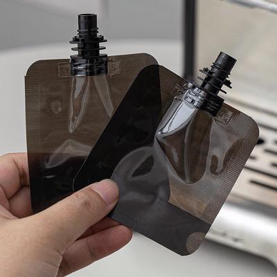 China Disposable Black Spout Pouch Suction Nozzle Clear Small Plastic Bag Bolsas Para Jugos Liquidos Spout Pouch for sale