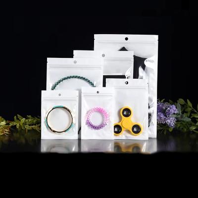 China Custom Clear Plastic Ziplock Opp Bag Transparent Lucent Plastic Pouch Electronics Accessories Packaging Bag with Hanging Hole for sale
