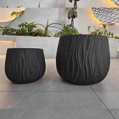 China Modern Round Heavy Fiber Clay Planter Hand Carved 22 lbs Frost Resistant for Home Garden for sale