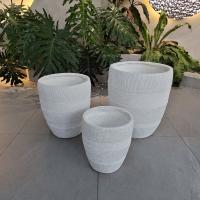 China Fiber Clay Planter Round Hand Carved Texture Frost Resistant 10-30 Inch Indoor Outdoor for sale