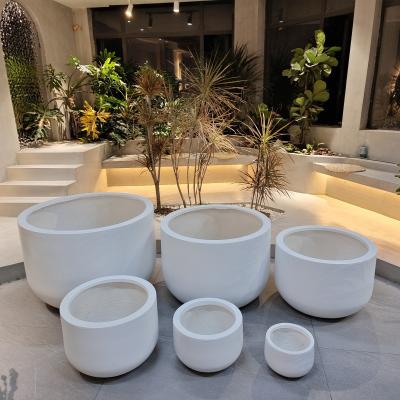 China Quangui Fiber Clay Planter 22in Round with Drainage Holes for Indoor Outdoor Use for sale