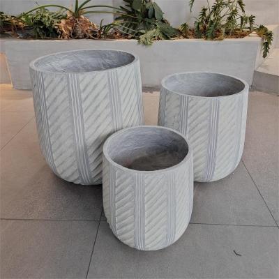 China Textured Round Fiber Clay Planter D480 H495 for Indoor Outdoor Garden Decor for sale