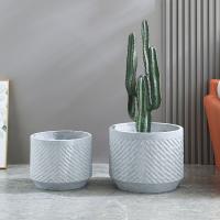 China Frost Resistant Patio Fiber Clay Planters Round Shape for sale