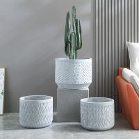 China Frost Resistant Patio Fiber Clay Planters Round Shape for sale