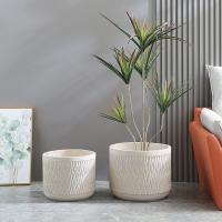China Frost Resistant Patio Fiber Clay Planters Round Shape for sale