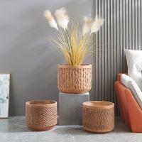 China Frost Resistant Patio Fiber Clay Planters Round Shape for sale