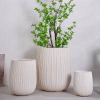 China Fiber Clay Planter Round Shape with Drainage Custom Color for Indoor Outdoor Garden Decor for sale