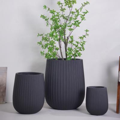 China Fiber Clay Planter Round Shape with Drainage Custom Color for Indoor Outdoor Garden Decor for sale