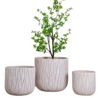 China Neutral Beige Round Fiber Clay Planter With Vertical Wood-grain Pattern for sale