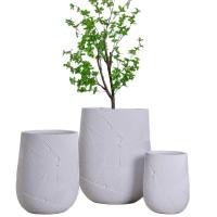China Radial Geometric Pattern Neutral White Round Fiber Clay Plant Pot for sale