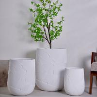 China Radial Geometric Pattern Neutral White Round Fiber Clay Plant Pot for sale