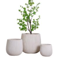 China Vertical Ribbed Pattern Neutral Beige Round Fiber Clay Lightweight Durable Planter for sale