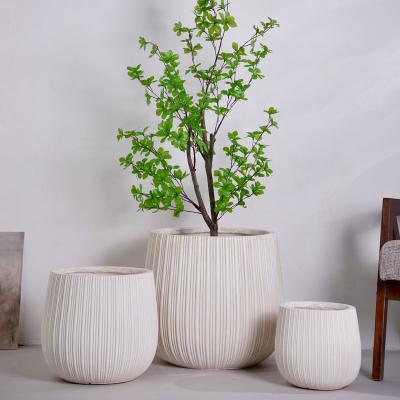 China Vertical Ribbed Pattern Neutral Beige Round Fiber Clay Lightweight Durable Planter for sale