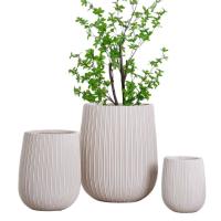 China Vertical Lines Pattern Neutral Beige Round Fiber Clay Planter Custom Color for sale