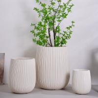 China Vertical Lines Pattern Neutral Beige Round Fiber Clay Planter Custom Color for sale