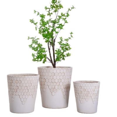 China Smooth Honeycomb Pattern Neutral Beige Round Fiber Clay Planter for sale