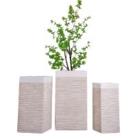 China Neutral Beige Vertical Stripe Pattern Round Fiber Clay Flower Pot In Upscale Settings for sale