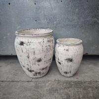 China Irregular Black Brush White Round Fiber Clay Planter Lobby Redesign for sale