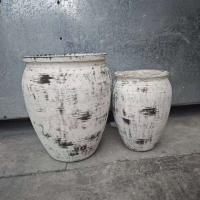 China Irregular Black Brush White Round Fiber Clay Planter Lobby Redesign for sale