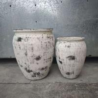 China Irregular Black Brush White Round Fiber Clay Planter Lobby Redesign for sale
