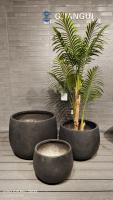 China Timeless Modern Style Black Round Fiber Clay Planter Smooth Matte Pattern for sale