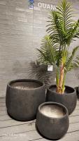 China Timeless Modern Style Black Round Fiber Clay Planter Smooth Matte Pattern for sale