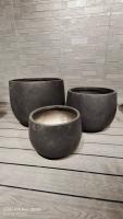 China Timeless Modern Style Black Round Fiber Clay Planter Smooth Matte Pattern for sale