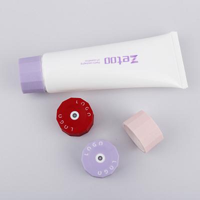 China D40 40mm Round Cosmetic Tubes with Two-Color Leather Texture Center-Dispensing Caps 50-125ml Capacity for sale
