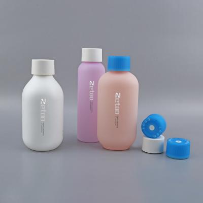 China 250ml 300ml Round Cosmetic PE Bottles with 40mm Two-Color Matte Center-Dispensing Cap - P7-A Model for sale
