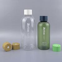 China Transparent Plastic Cosmetic Bottle 250ml 300ml with 40mm Leather Texture Center-Dispensing Cap for sale