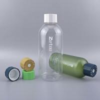 China Transparent Plastic Cosmetic Bottle 250ml 300ml with 40mm Leather Texture Center-Dispensing Cap for sale
