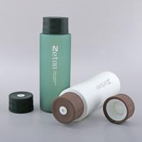 China Custom PE Cosmetic Bottle 45mm Two Color Plaid Center Dispensing Cap Soft Touch for sale
