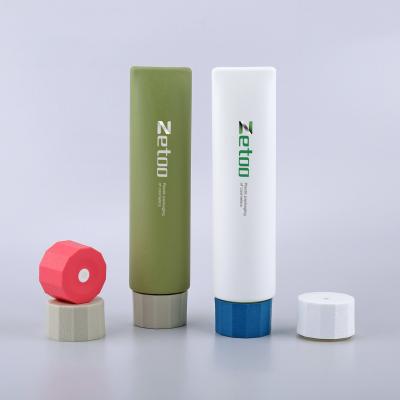 China 120ml Soft Touch PE Cosmetic Bottle with 40mm Two-Color Leather Texture Dispensing Cap for Skin Care Products for sale