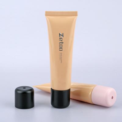China 25mm Diameter PE Cosmetic Tube 20ml-60ml with Two-Color Matt Center-Dispensing Cap for sale