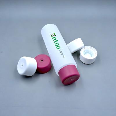 China PE Soft Touch Cosmetic Bottle 45mm Diameter Two Color Matt Center Twist Cap Custom Capacity for sale