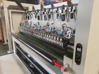 China Hot Melt Glue Spray Laminating Machine Ideal for Automotive Interiors and Carbon Fiber for sale