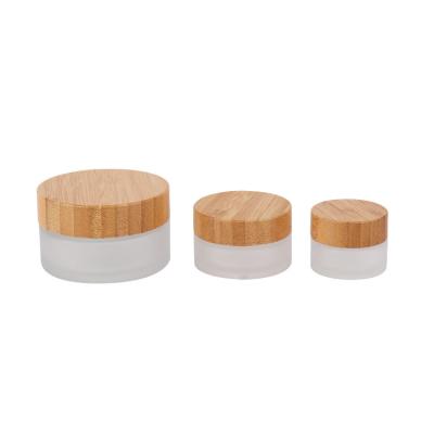 China 10ml 30ml 50ml 100ml 150ml 200ml 250ml Frosted Glass Cream Jar With Bamboo Lid for sale