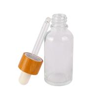 China Round Cosmetic Dropper Bottle Bamboo Glass Dropper Bottle 15ml 20ml 30ml 50ml 100ml for sale