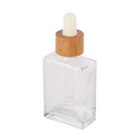 China 30ml 50ml 100ml Square Clear Glass Dropper Bottle Eco Friendly Bamboo Essential Oil Bottle for sale