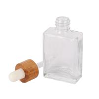 China 30ml 50ml 100ml Square Clear Glass Dropper Bottle Eco Friendly Bamboo Essential Oil Bottle for sale