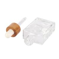 China 30ml 50ml 100ml Square Clear Glass Dropper Bottle Eco Friendly Bamboo Essential Oil Bottle for sale