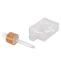 China 30ml 50ml 100ml Square Clear Glass Dropper Bottle Eco Friendly Bamboo Essential Oil Bottle for sale