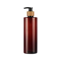 China 60ml 80ml 100ml 120ml 150ml 180ml 200ml 250ml 300ml Natural Elegant Amber Flat Shoulder PET Bottle With Natural Bamboo Lotion Pump for sale