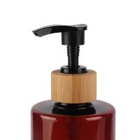 China 60ml 80ml 100ml 120ml 150ml 180ml 200ml 250ml 300ml Natural Elegant Amber Flat Shoulder PET Bottle With Natural Bamboo Lotion Pump for sale