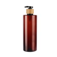 China 60ml 80ml 100ml 120ml 150ml 180ml 200ml 250ml 300ml Luxury And Elegant Amber Flat Shoulder PET Bottle With Natural Bamboo Lotion Pump for sale
