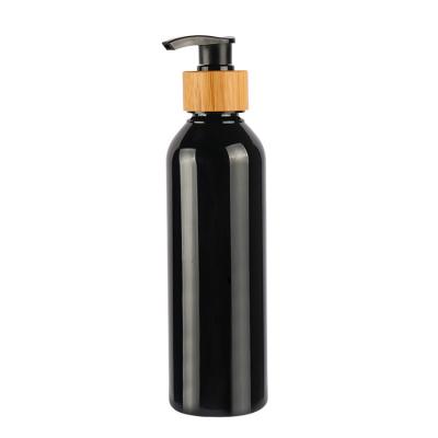 China Black Round Shoulder Cosmetic Lotion Bottle Bamboo PET Bottle 180ml 200ml 250ml 300ml for sale
